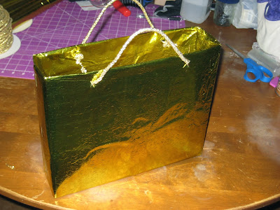 Pondering Cat: Gift bag made from a cereal box.