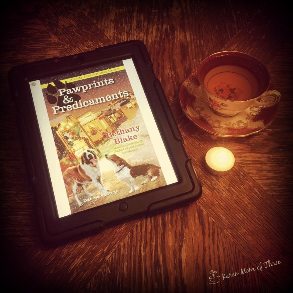 A Cup Of Tea and A Cozy Mystery: Pawprints & Predicaments by Bethany Blake