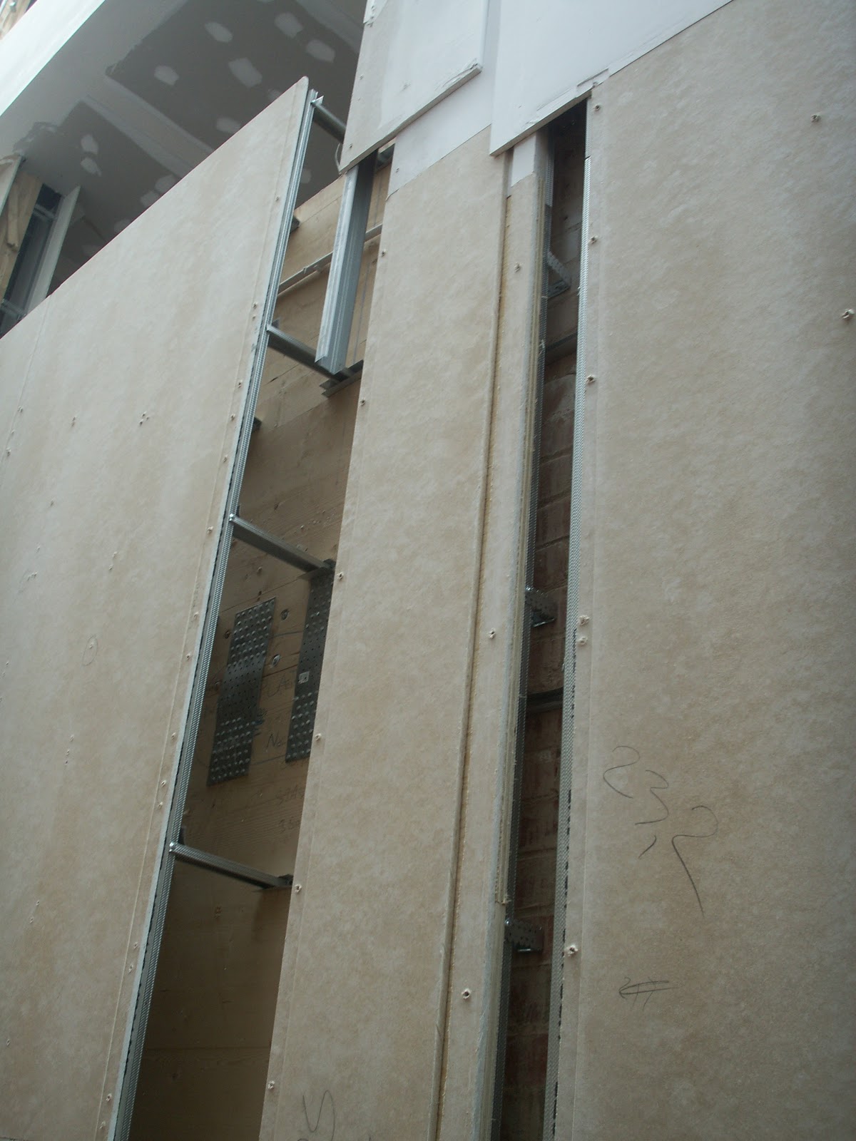 D.R. INTERIORS: 9m(high) x 40m (long) two walls in the slot (walls done ...