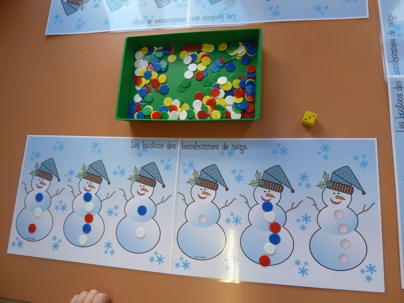 Amiscol: Jeu " Les boutons des bonshommes de neige