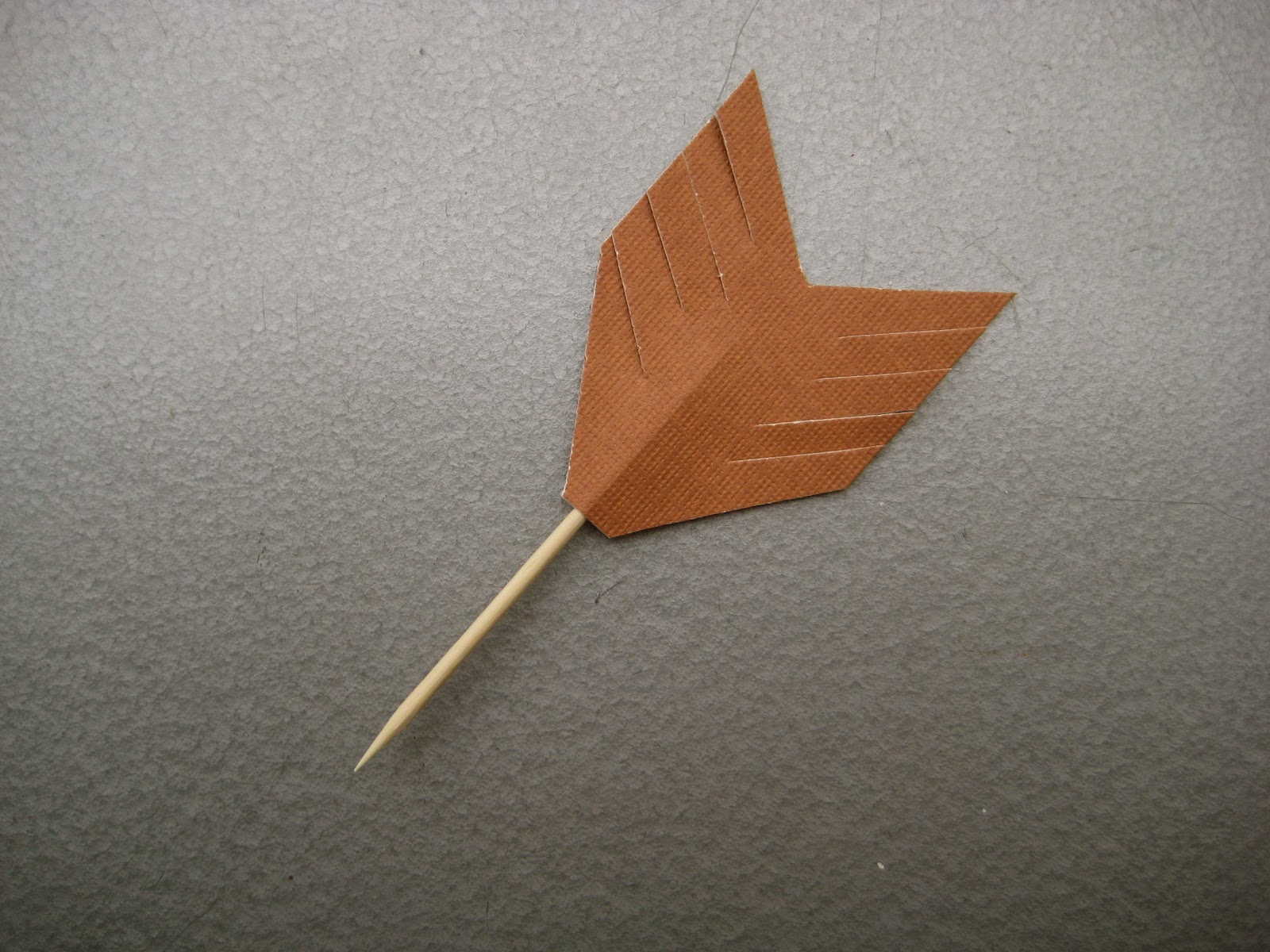 cue the confetti: arrow cupcake toppers