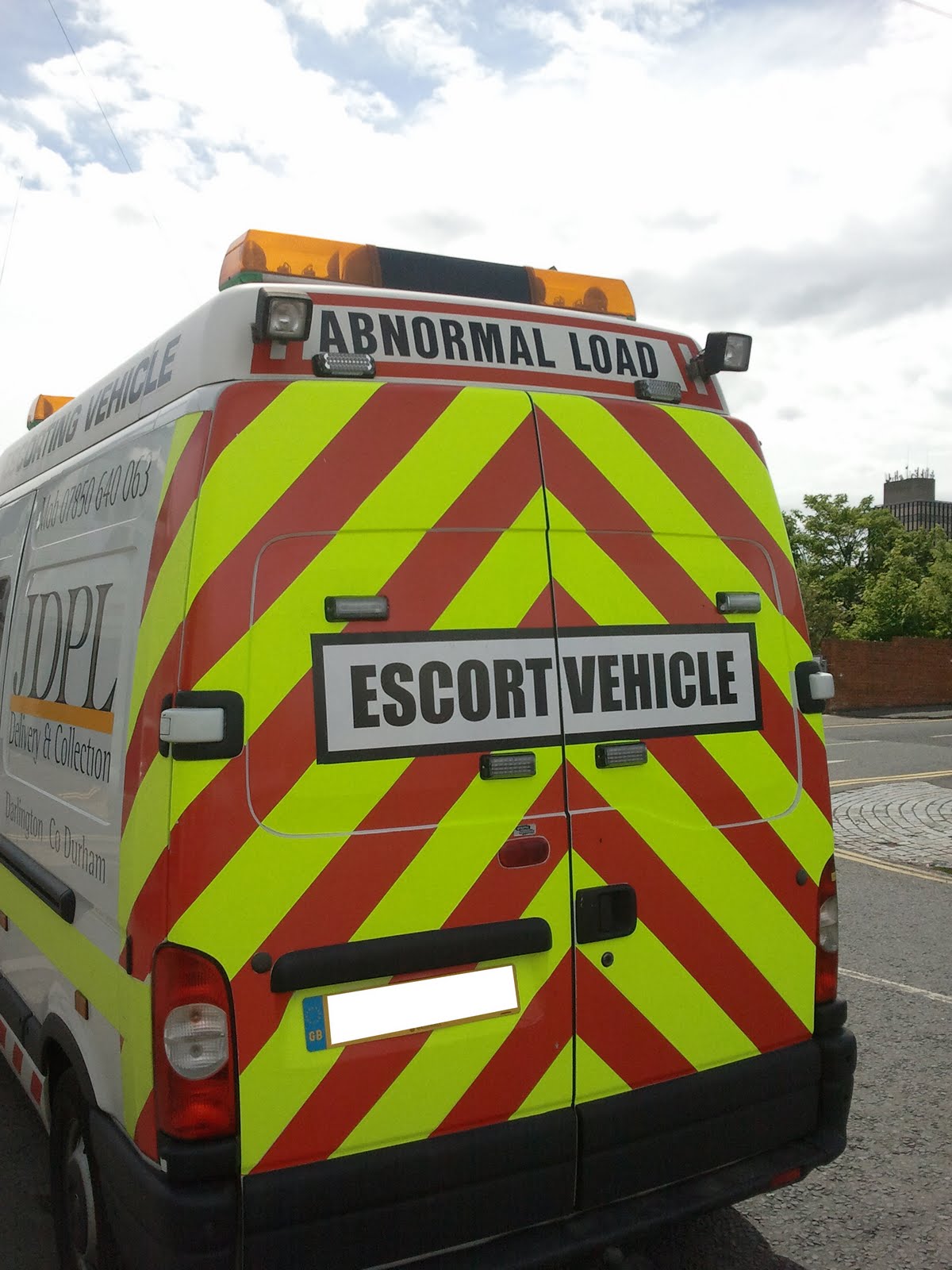 The Green I Signs Blog: wide load escorting vehicle stripes in day glo ...