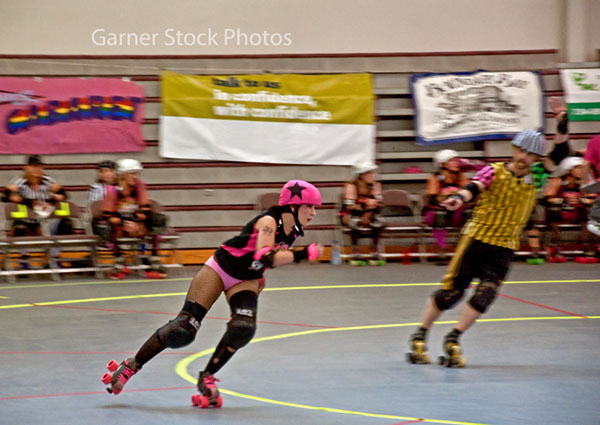 Stock and Fine Art Photos: Woman Jammer in Roller Derby Event