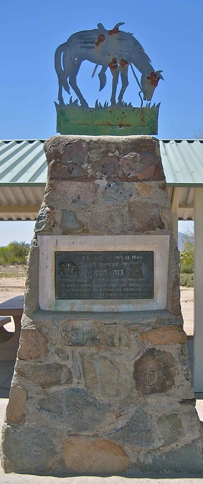 Tenth Letter of the Alphabet: Street Scene: Tom Mix Memorial