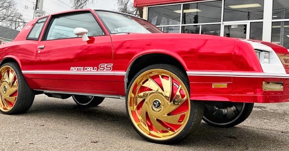 Ace-1: Chrome Red Chevy Monte Carlo SS on Gold 26" DUB Zoom Floaters