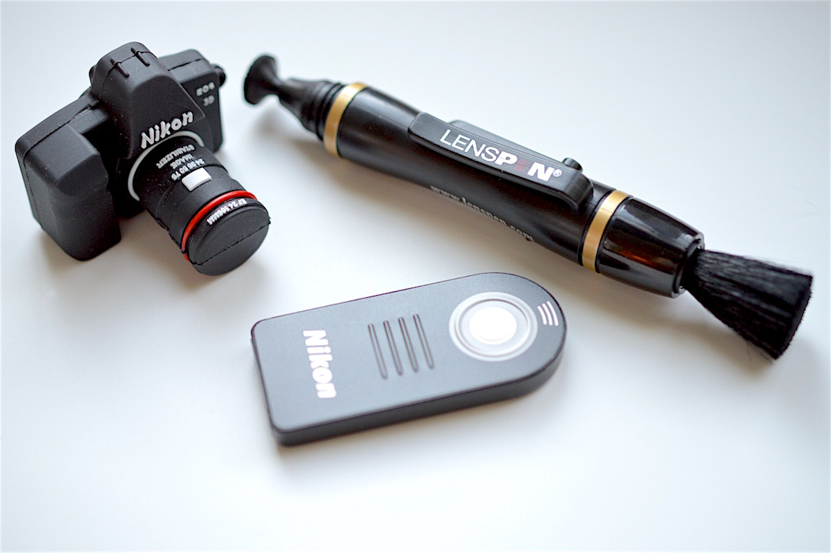 A tiny memory stick disguised as a camera, my LensPen and remote