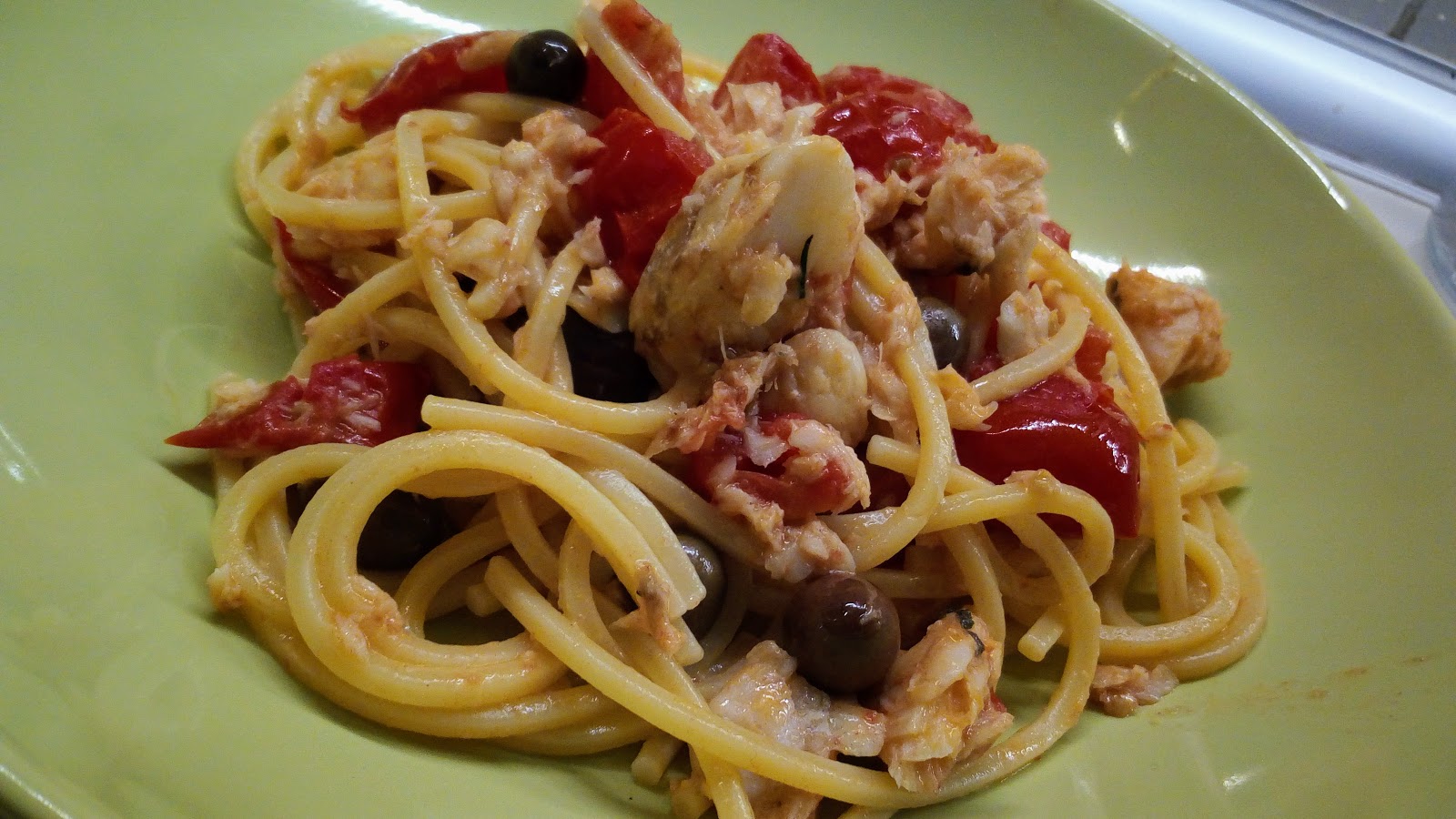 spaghetti con merluzzo olive e pomodorini
