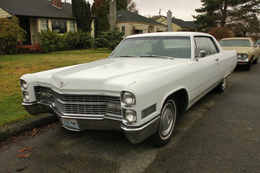OLD PARKED CARS.: 1966 Cadillac Calais.