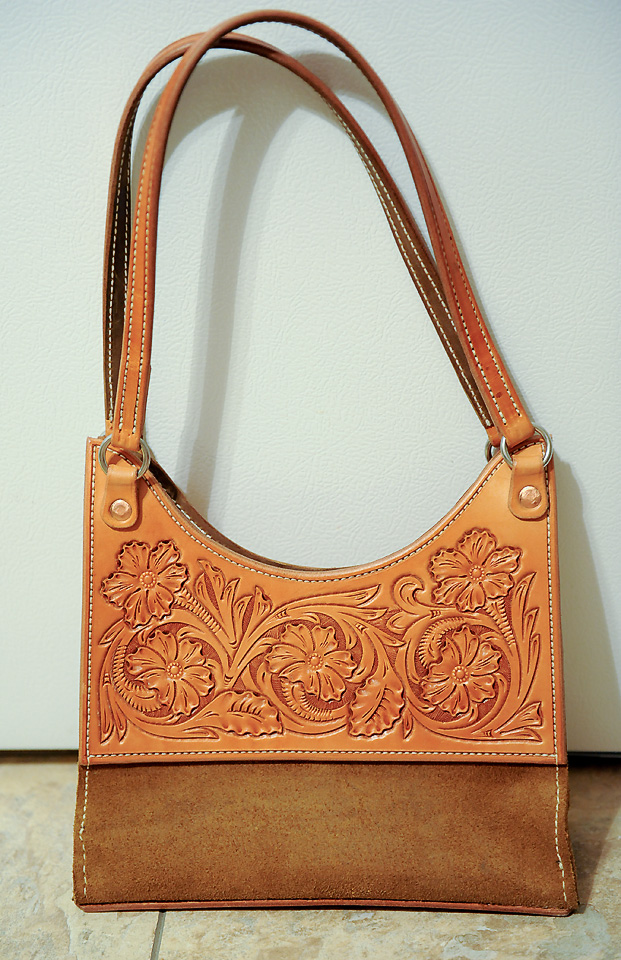 JD Folsom Custom Leather: Custom floral carved purses.