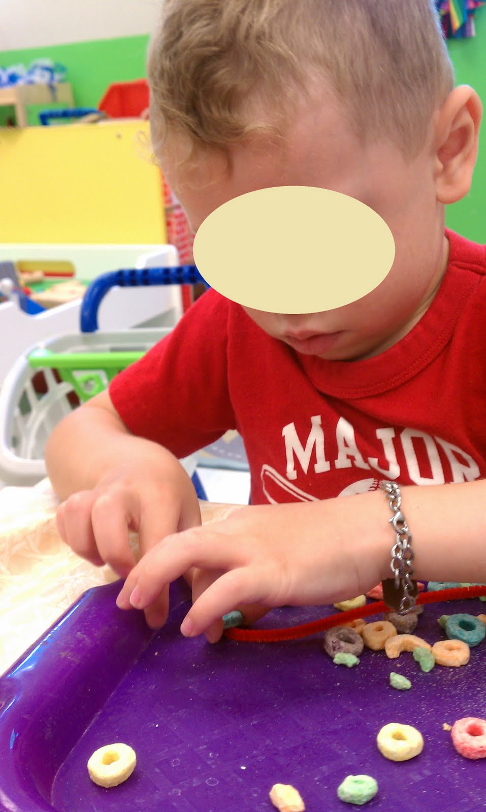 Play-Based Classroom: Lacing with cereal