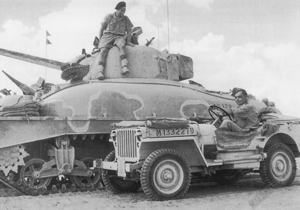 A Sherman tank being recovered from the river Biferno near Campo-Marino ...
