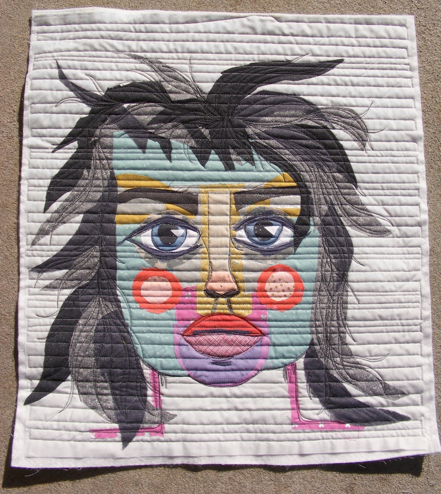 TIA CURTIS QUILTS: I have also been making faces.