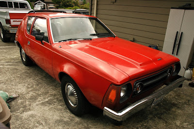 OLD PARKED CARS.: 1976 AMC Gremlin.