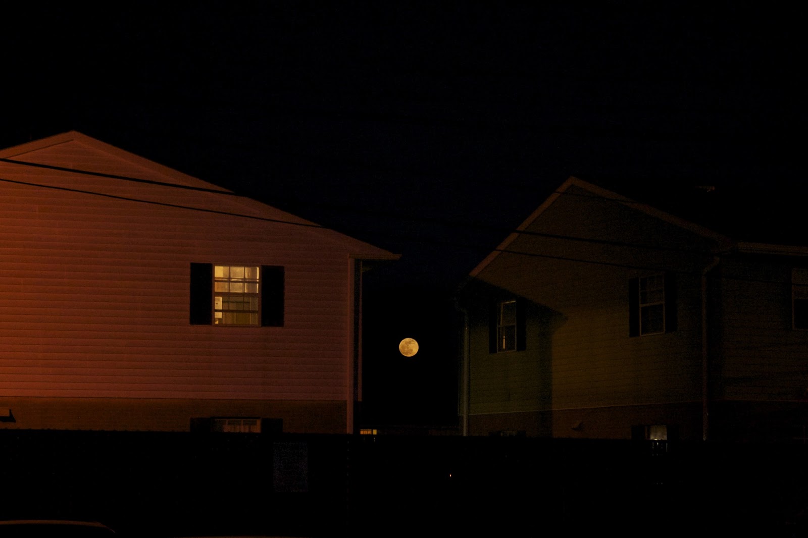 Full moon rising between apartment buildings [Stellar Neophyte ...