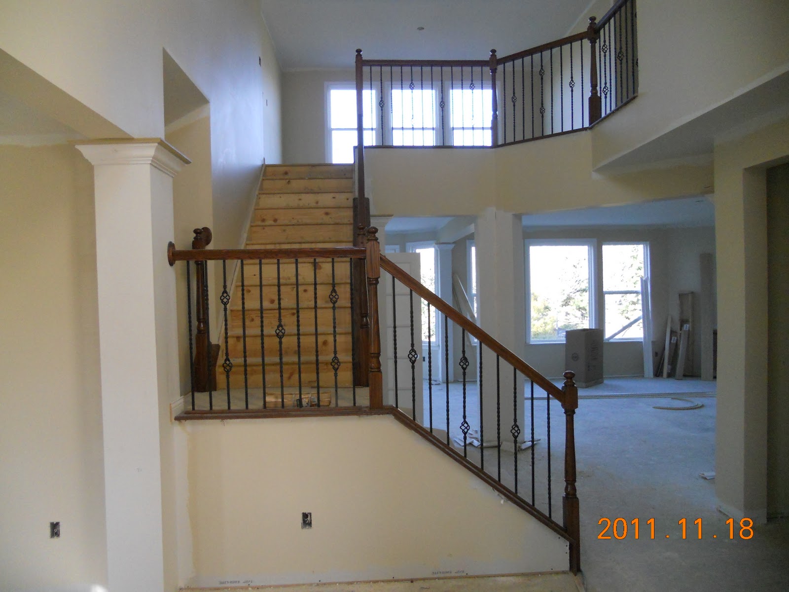 Brick work complete, stair railing installed and trim work in progress ...