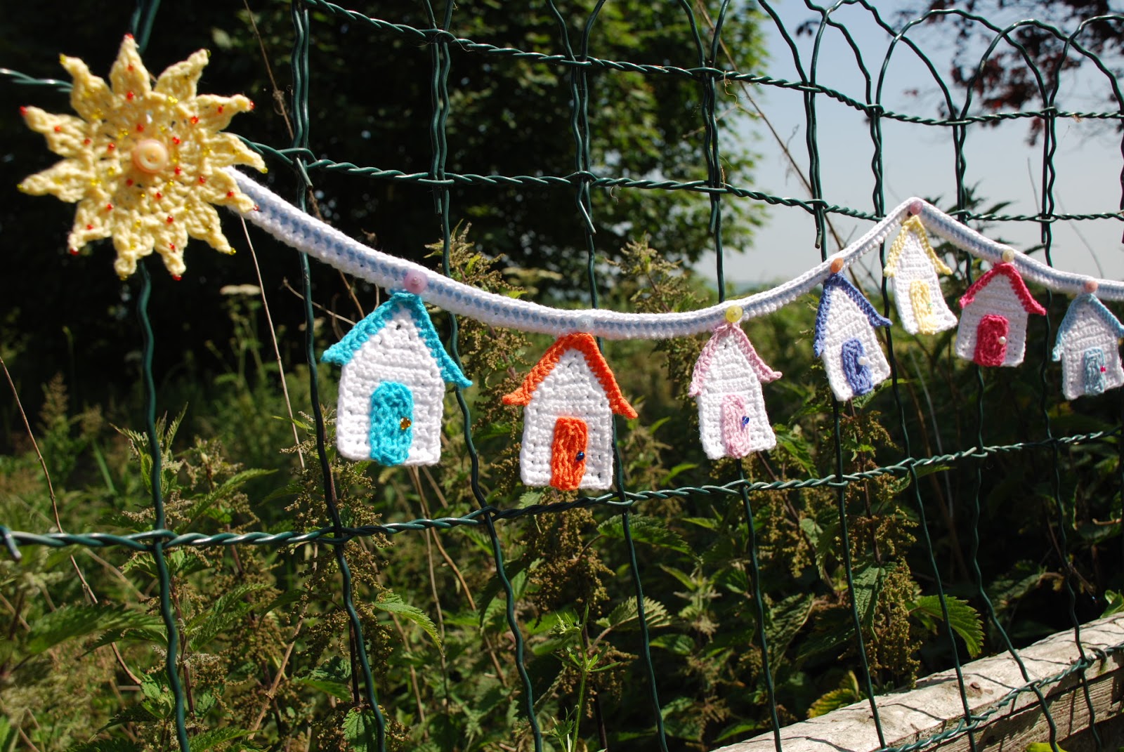 Crochet Beach Hut Bunting | Crochet garland, Knitted bunting, Crochet ...