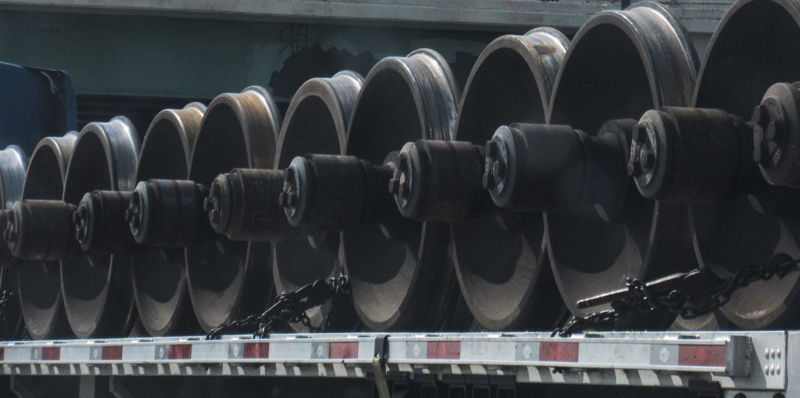 Images from my peripatetic life: Train axles in transit, Ohio