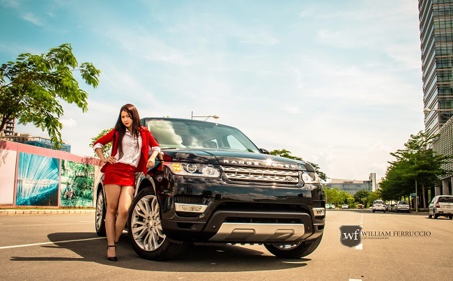 Rebellion office girl poses with Range Rover Sport | Carsfresh
