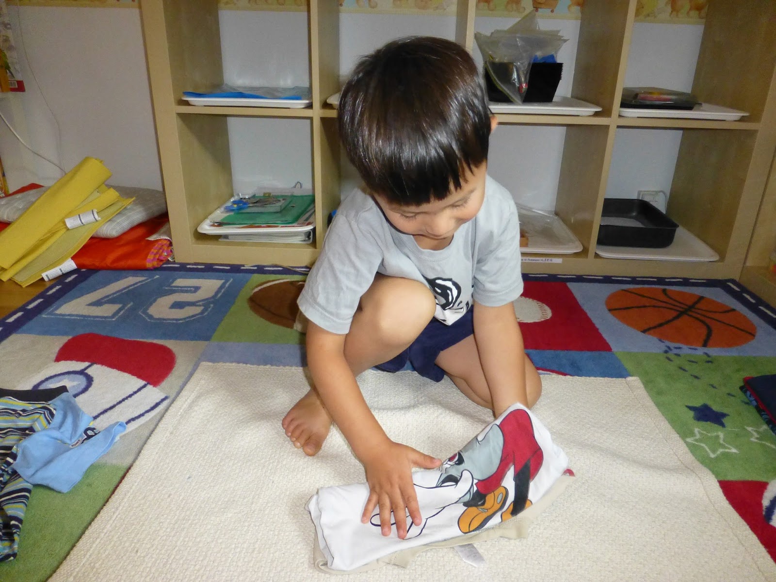 Family FECS: Montessori Activity: Folding Clothes