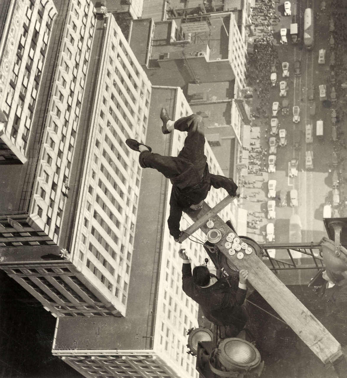 VINTAGE PHOTOGRAPHY: A man balancing on a piece of wood on the roof of ...