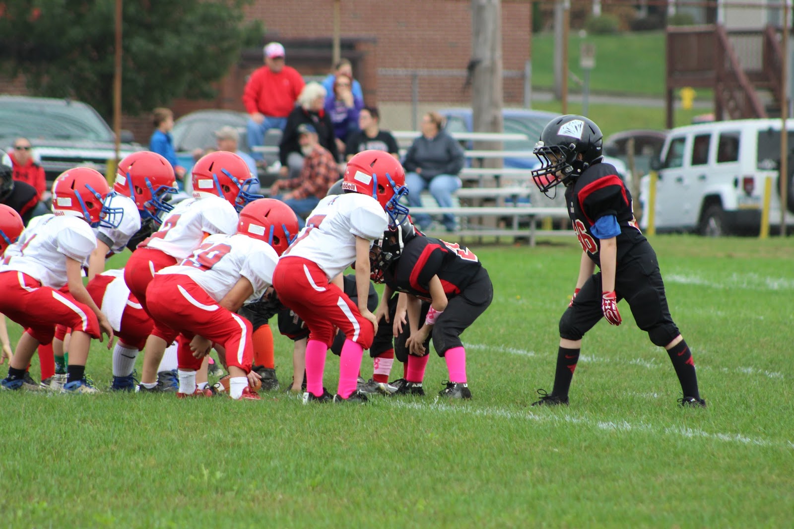 Youth Football Players Honor Breast Cancer Victims and Survivors During ...