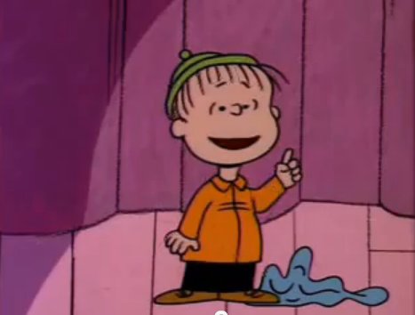 Linus drops his blanket as he recites the Bible verse in A Charlie ...
