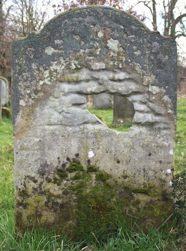 Grave Mistakes: A large hole has formed right through the gravestone.