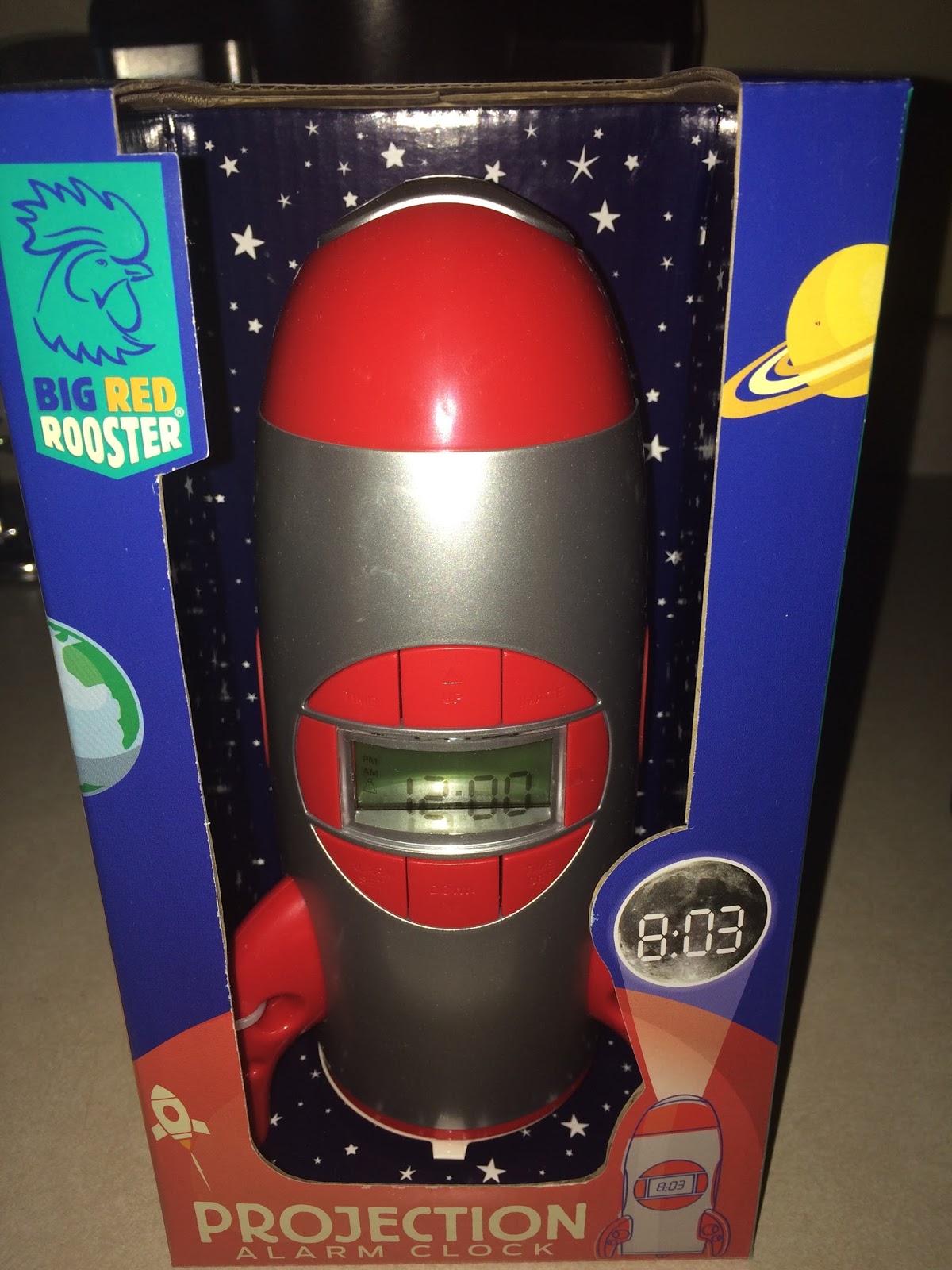 Fly to the moon on the Big Red Rooster Rocket Ship Projection Alarm ...