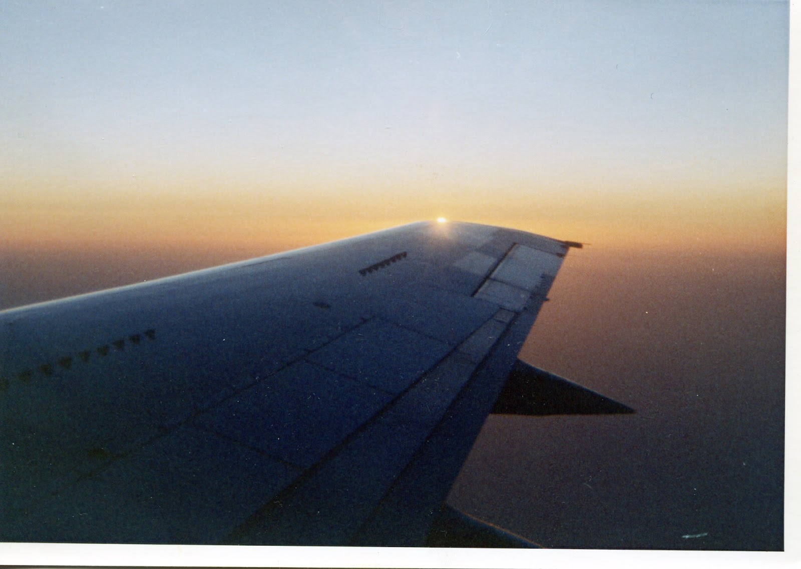 Rainbow Arc of Fire: Enlarged photo of 737-200 wing at sunset