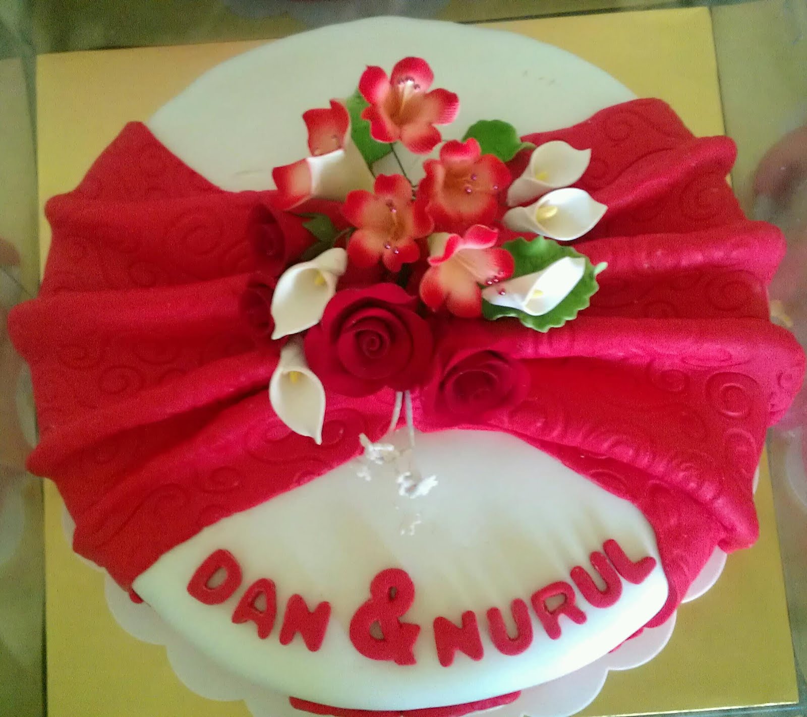 Red and white fondant cake