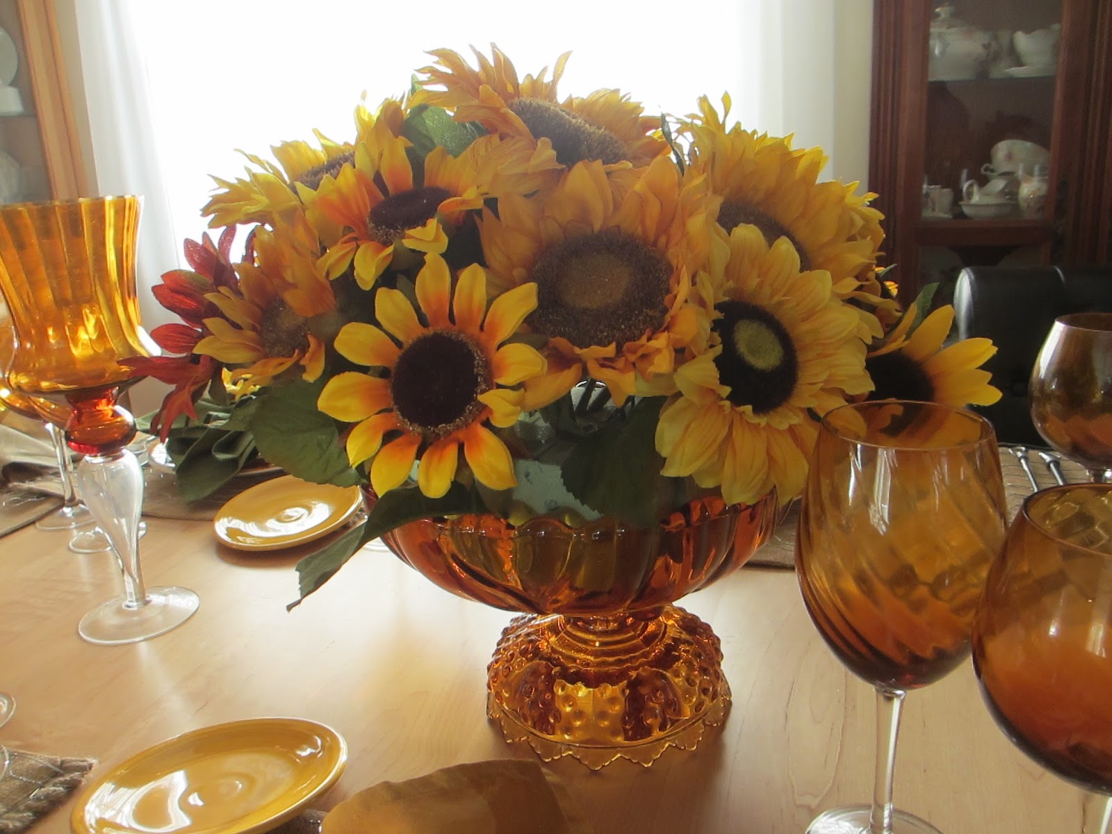 The Welcomed Guest: Sunflowers and Amber Table