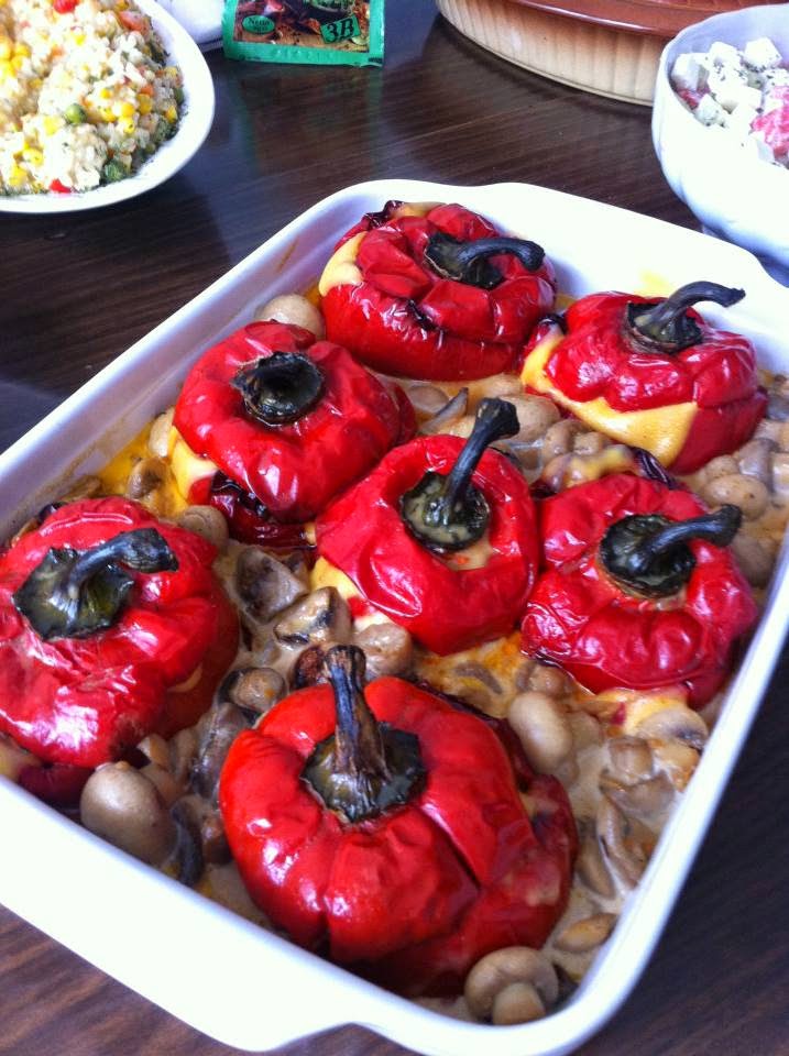 Filled paprika with tomato, olive rice and mushrooms