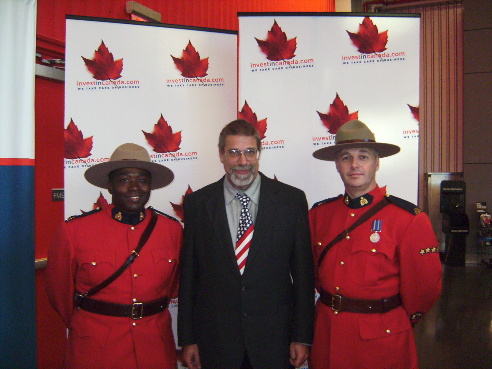 With two Mounties at the Canada Booth.