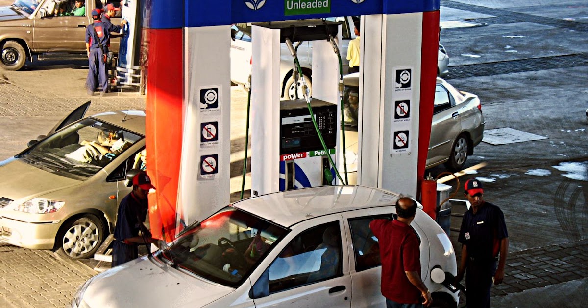 Stock Pictures: Petrol or gas being filled at the petrol pump