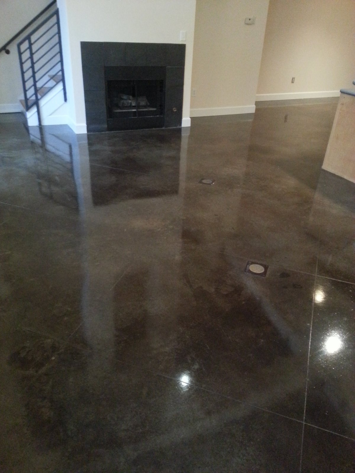 Epo- Floors: Waxed and buffed stained concrete