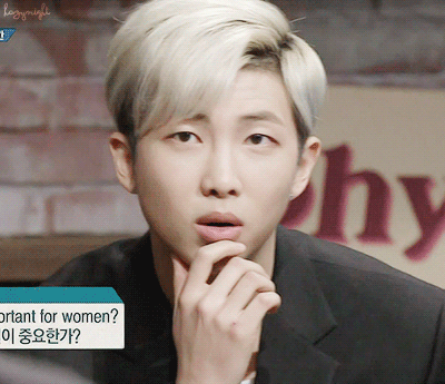 Sulli and BTS' Rap Monster smile in the same way