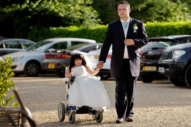 Tiniest bride has her dream wedding with her over 6ft tall groom