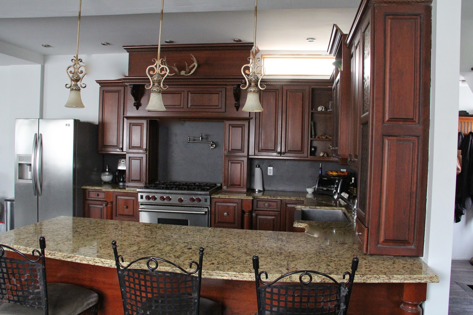 Sheer Serendipity: Charcoal black plaster backsplash