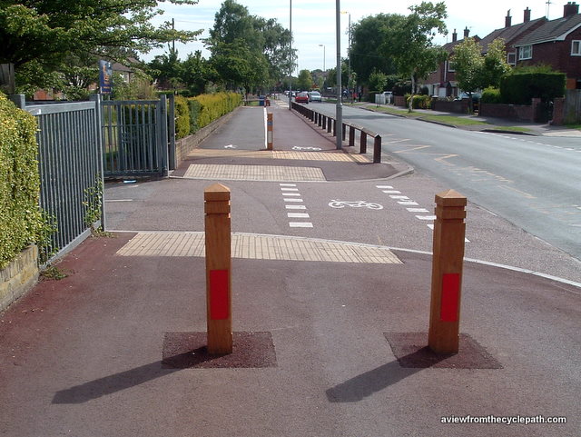 A view from the cycle path: Bollards on cycle-paths provide both an ...
