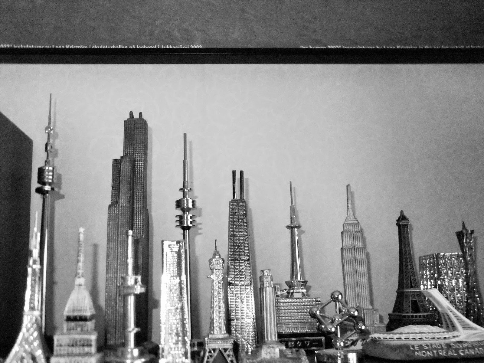The Last Details: A miniature skyline made of replicas of tall buildings.