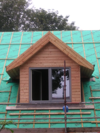 House build 2011: Progressing with roof, larch cladding and window ...