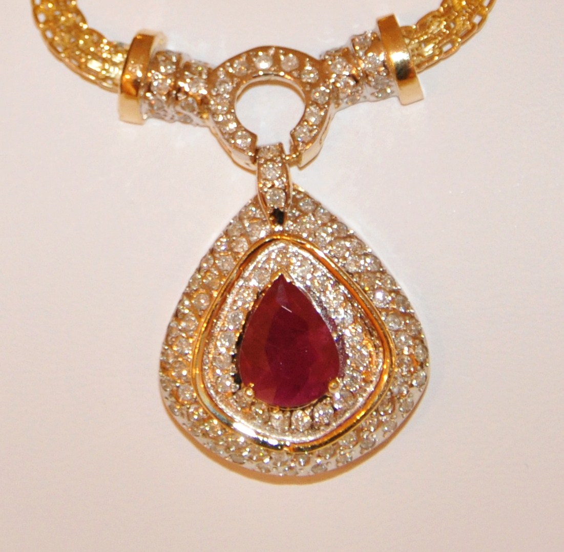Treasure Trove: Ruby and Diamond necklace in 18K gold.