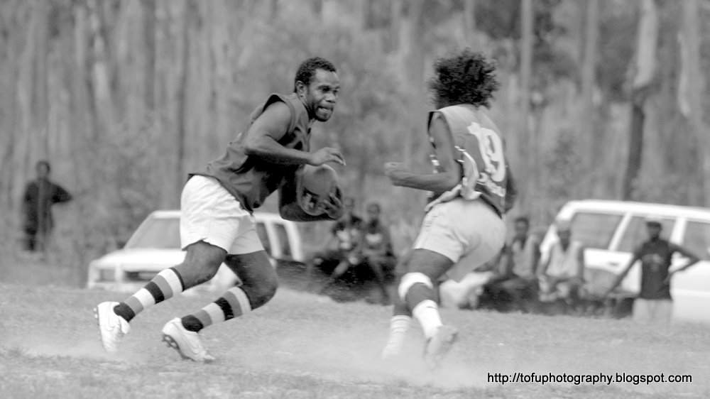 Tofu Photography: Two men playing football on the Aboriginal Community ...