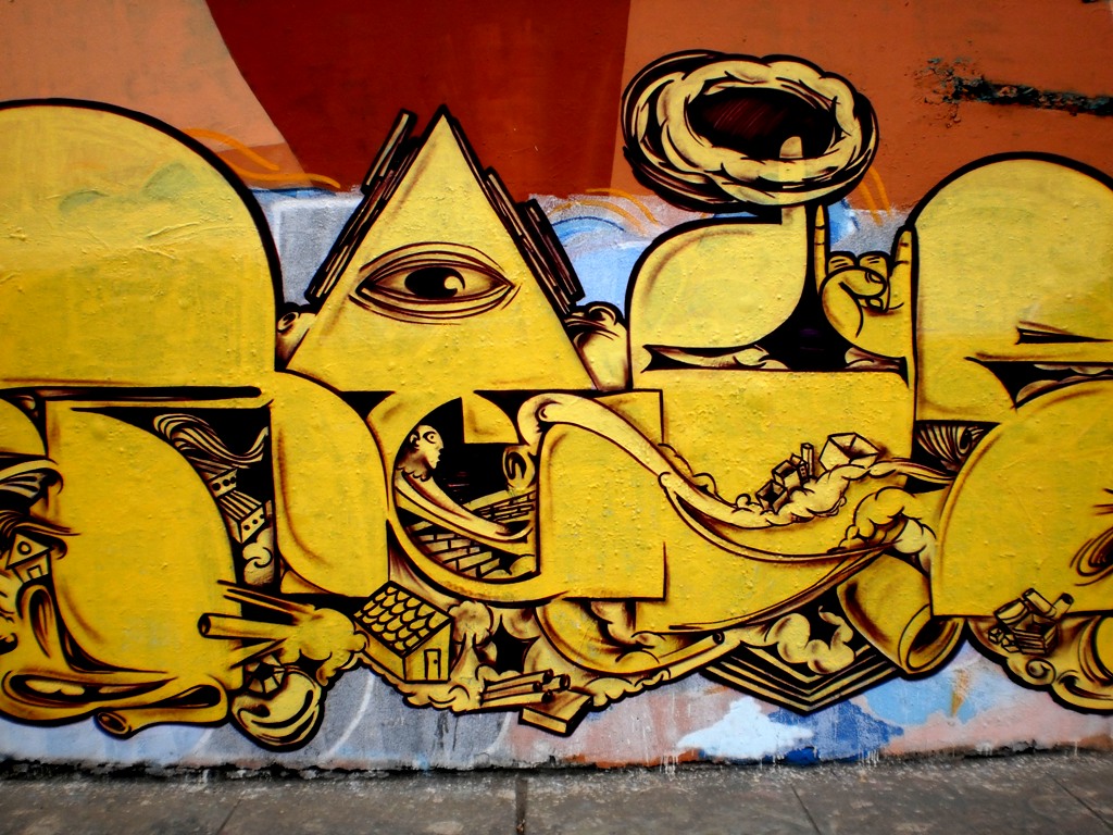 COMIC APOCALIPSIS: DIOS es un graffiti amarillo.