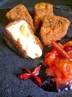 Marmaduke Scarlet: deep- fried breaded camembert with spicy plum sauce