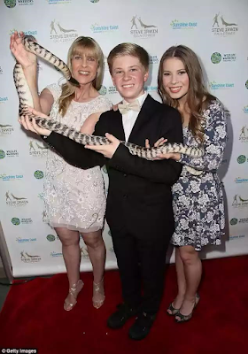 Irwin family attend gala in honour of their late father with a snake in tow