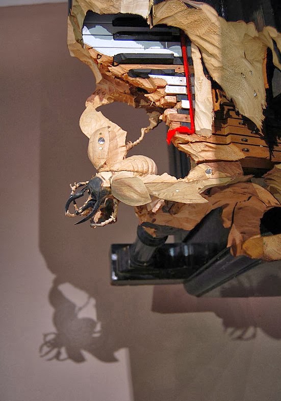 Sculptures that contrast carved areas with uncarved surfaces; The Idea ...