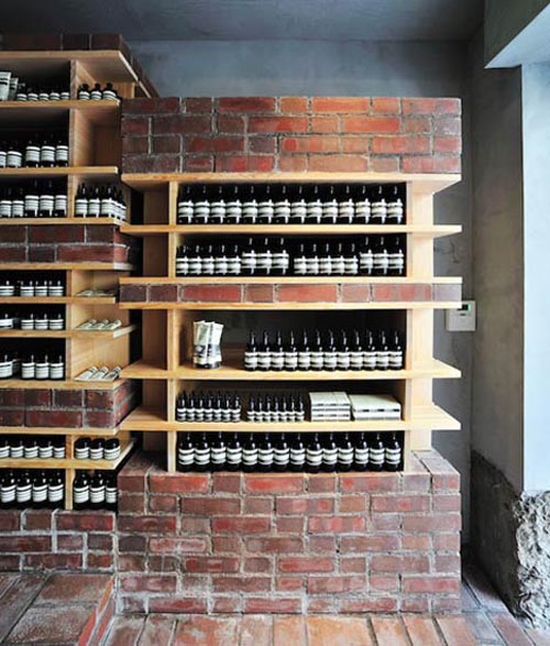 TRADITIONAL CHEMICAL STORE DESIGN WITH UNFINISHED BRICK INTERIOR