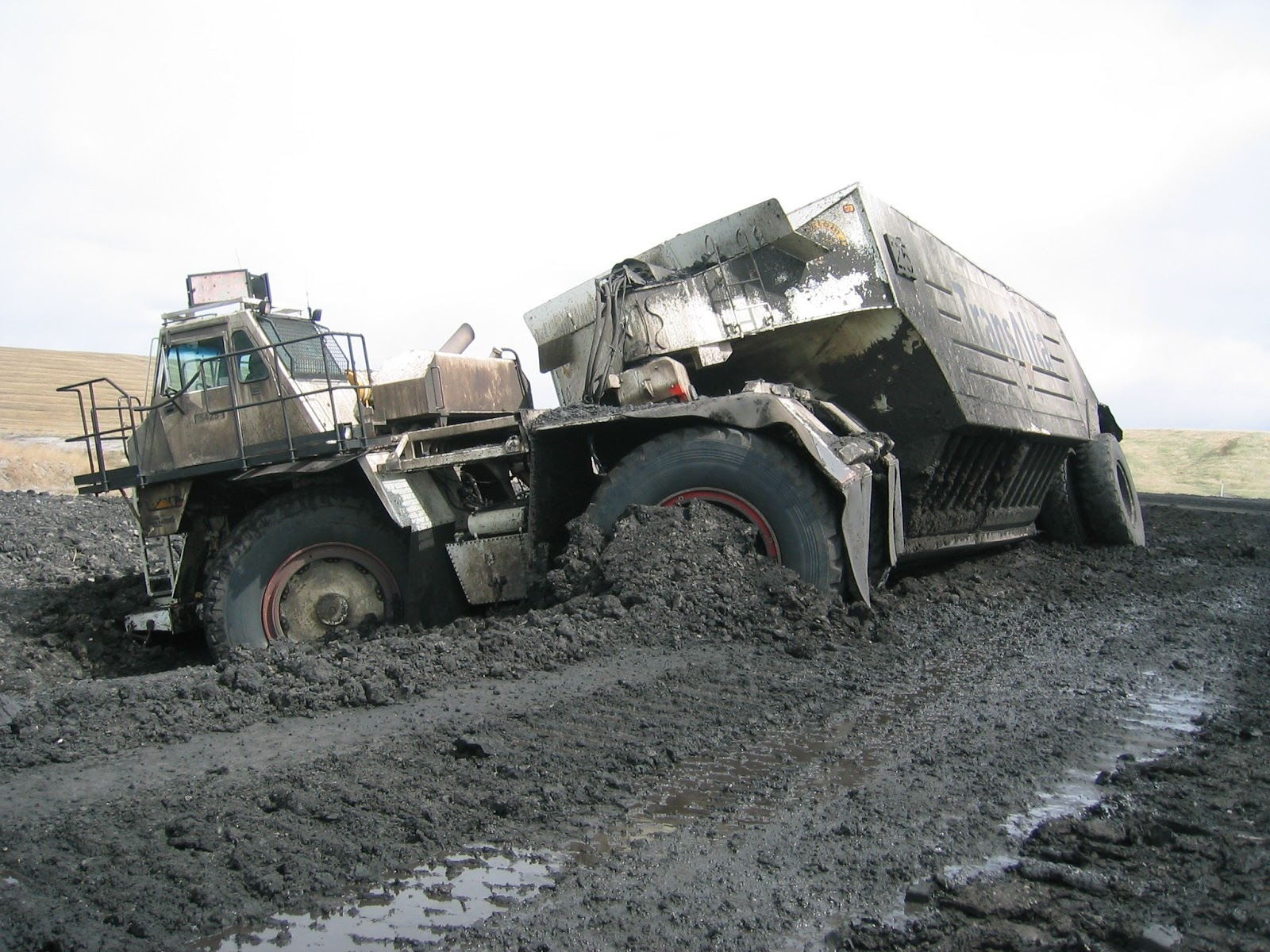 Mining Mayhem: Bogged Belly-Dumper