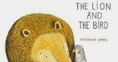Momo celebrating time to read: The Lion and the Bird by Marianne Dubuc